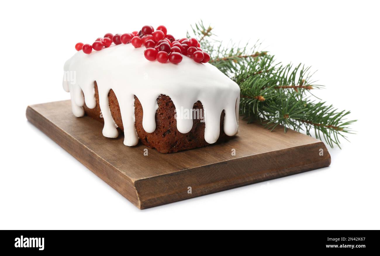 Traditional classic Christmas cake decorated with cranberries near fir ...