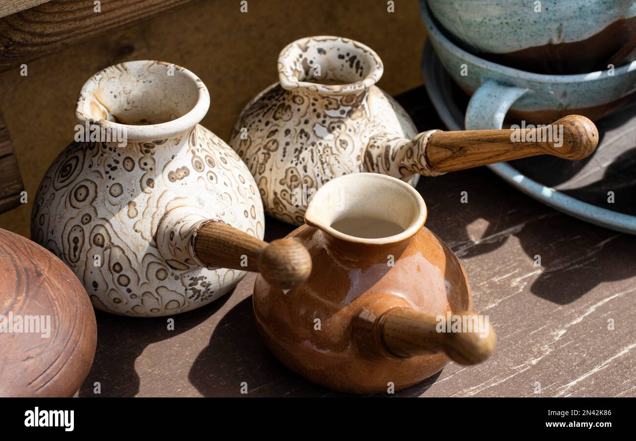Clay and ceramic Turks with long handles for making coffee, close-up ...