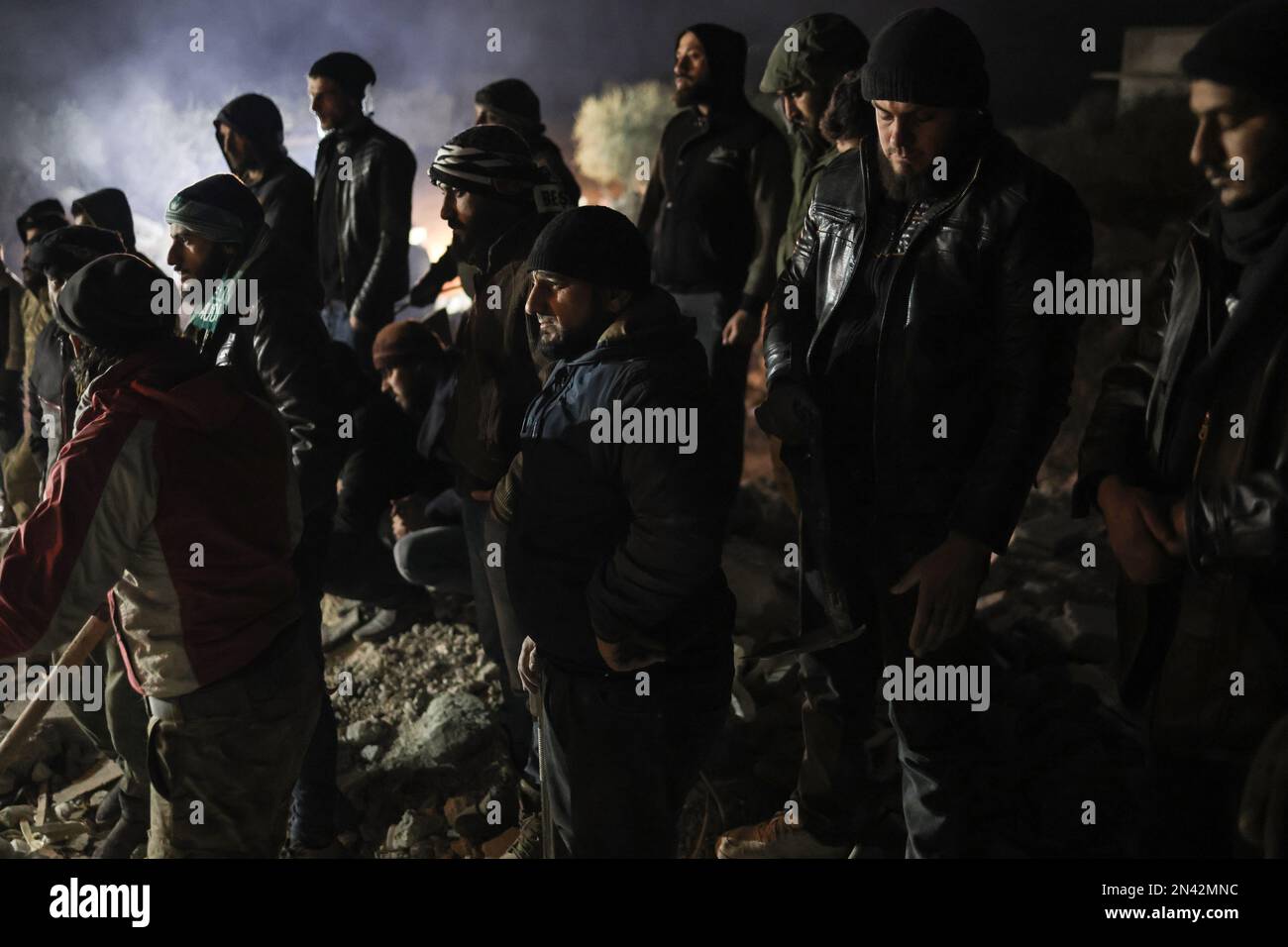 Jindires, Syria. 08th Feb, 2023. Syrians await to save a trapped boy ...