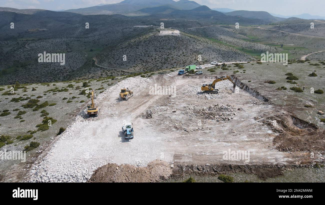 Heavy machines working on the mountain Stock Photo - Alamy