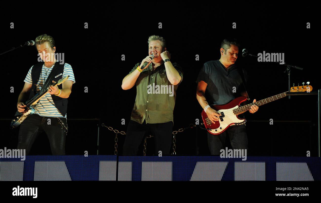 Joe Don Rooney, Gary LeVox, and Jay DeMarcus of Rascal Flatts perform ...
