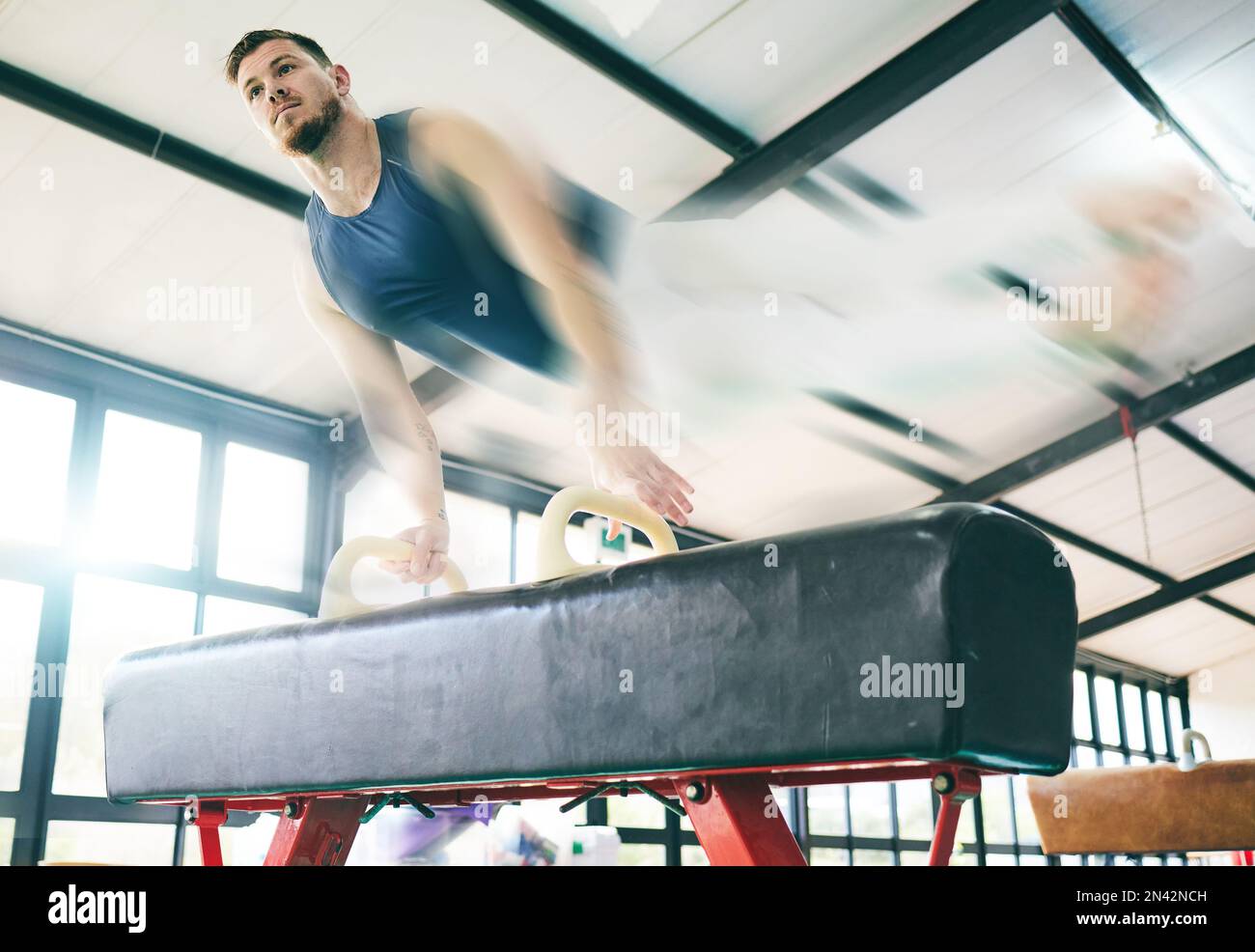 Fitness, gymnastics and balance beam with man for training, cardio and ...