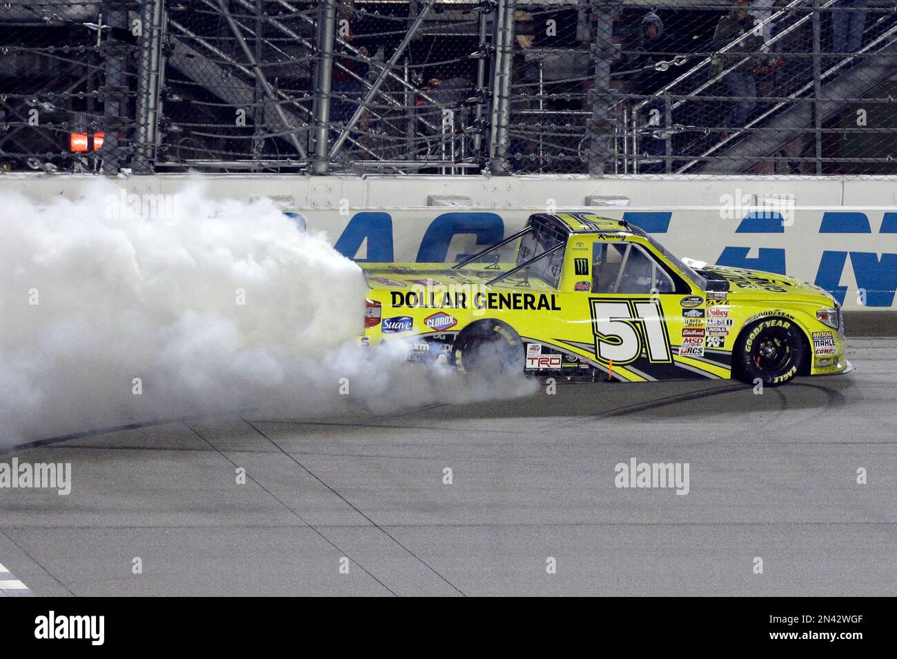 Kyle Busch (51) celebrates his win with a burnout after winning the ...