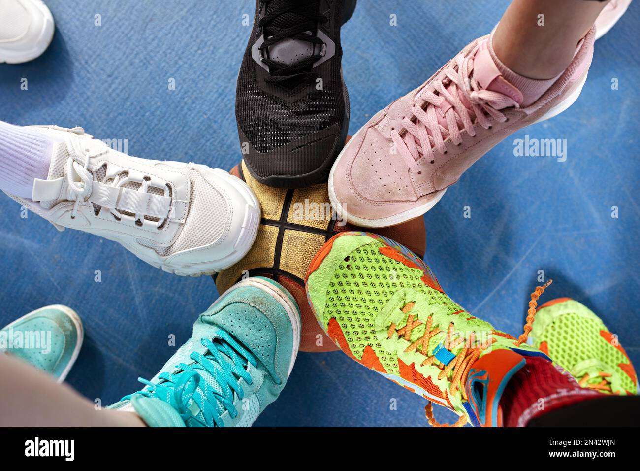 Bright and colorful sport shoes circle with basket ball top view. Set ...