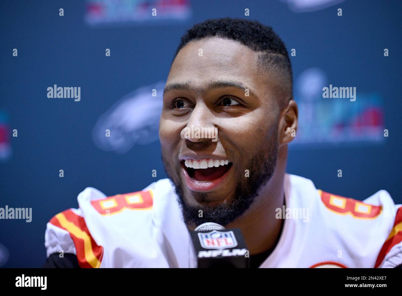 Kansas City Chiefs defensive end Carlos Dunlap speaks to members of the ...