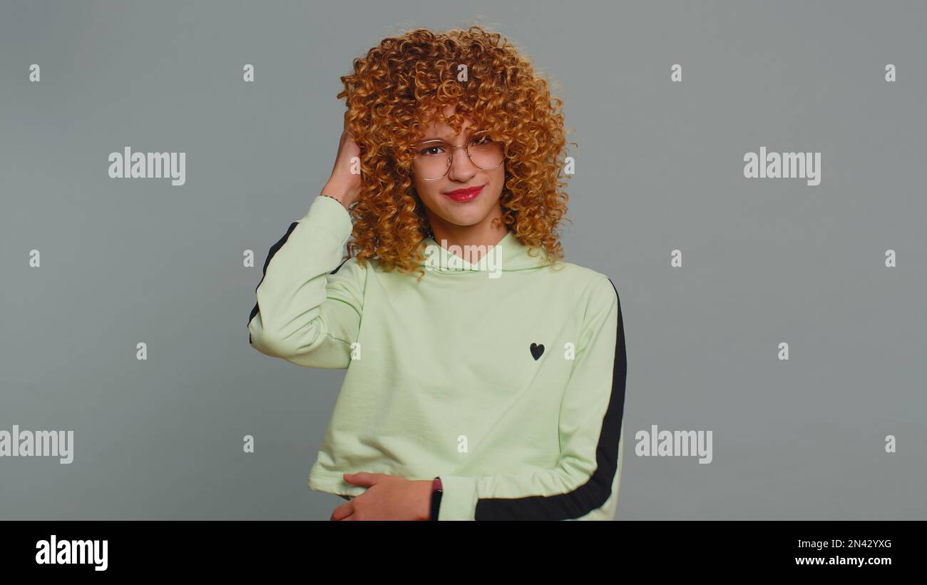 I dont know what to say. Confused young teenager school girl feeling ...