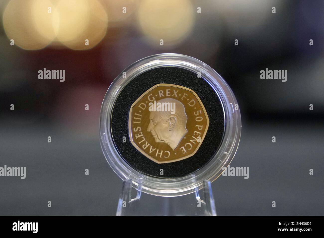 A 50p coin featuring the portrait of King Charles III, is displayed ...
