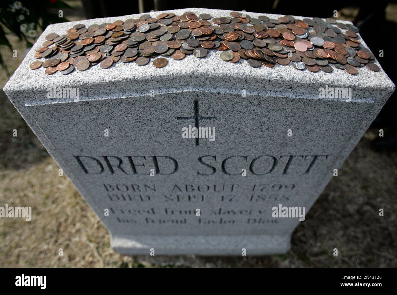 FILE - In this March 6, 2007 file photo, pennies rest on top of the ...