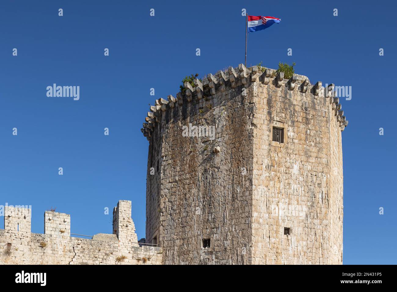 The dungeon of the Klis fortress high above the village with the same ...