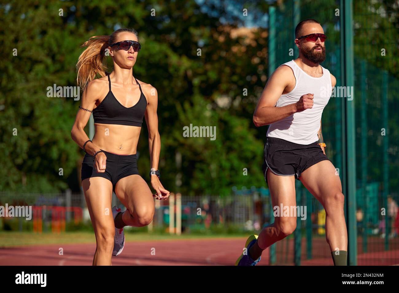 Woman and man doing jogging, diversity training of men and women together, healthy lifestyle ...