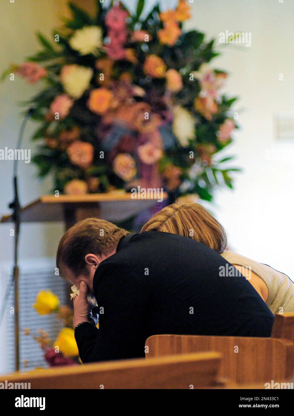 Timothy Jones, Sr., cries with his wife Julie Jones during a memorial ...
