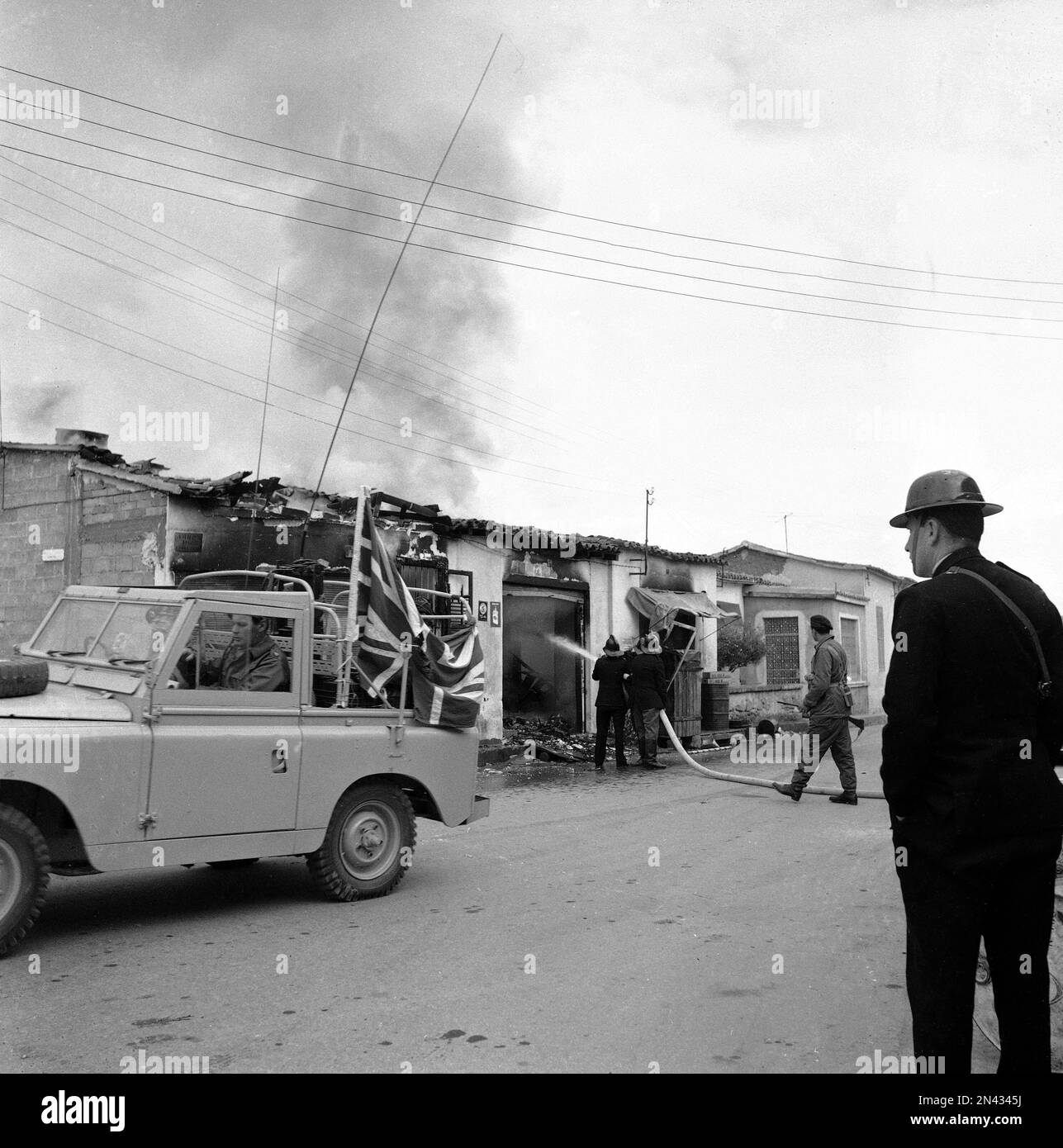 Cypriot firemen fight to extinguish fires that broke out in the Turkish sector of Nicosia ...