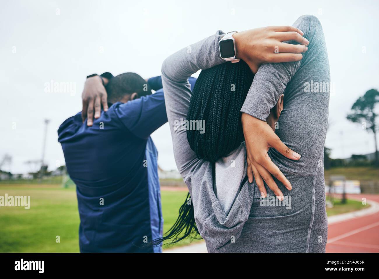 Fitness, back and black couple stretching arms outdoors for health and ...