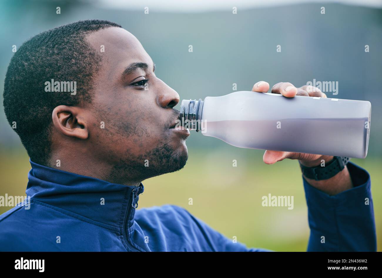 Fitness, health and side profile of black man drinking water to hydrate ...