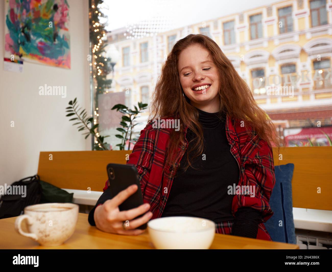 Multiracial friends girls and guys having fun laughing drinking coffee ...