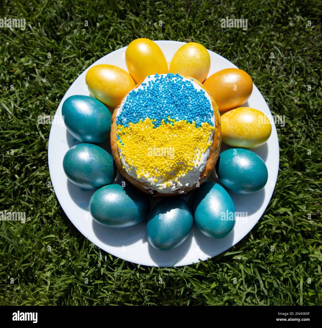 Composition with multi-colored blue and yellow Easter eggs around the ...