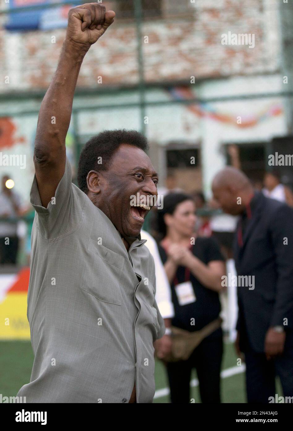 Brazilian soccer great Pele, pumps his fist in the air while he poses ...