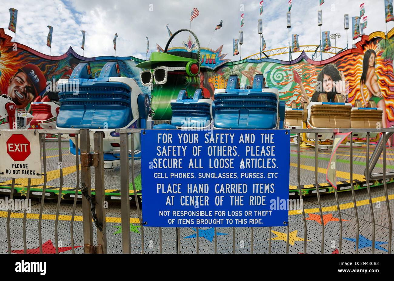 A safety sign is pictured on a ride at the state fairgrounds in ...