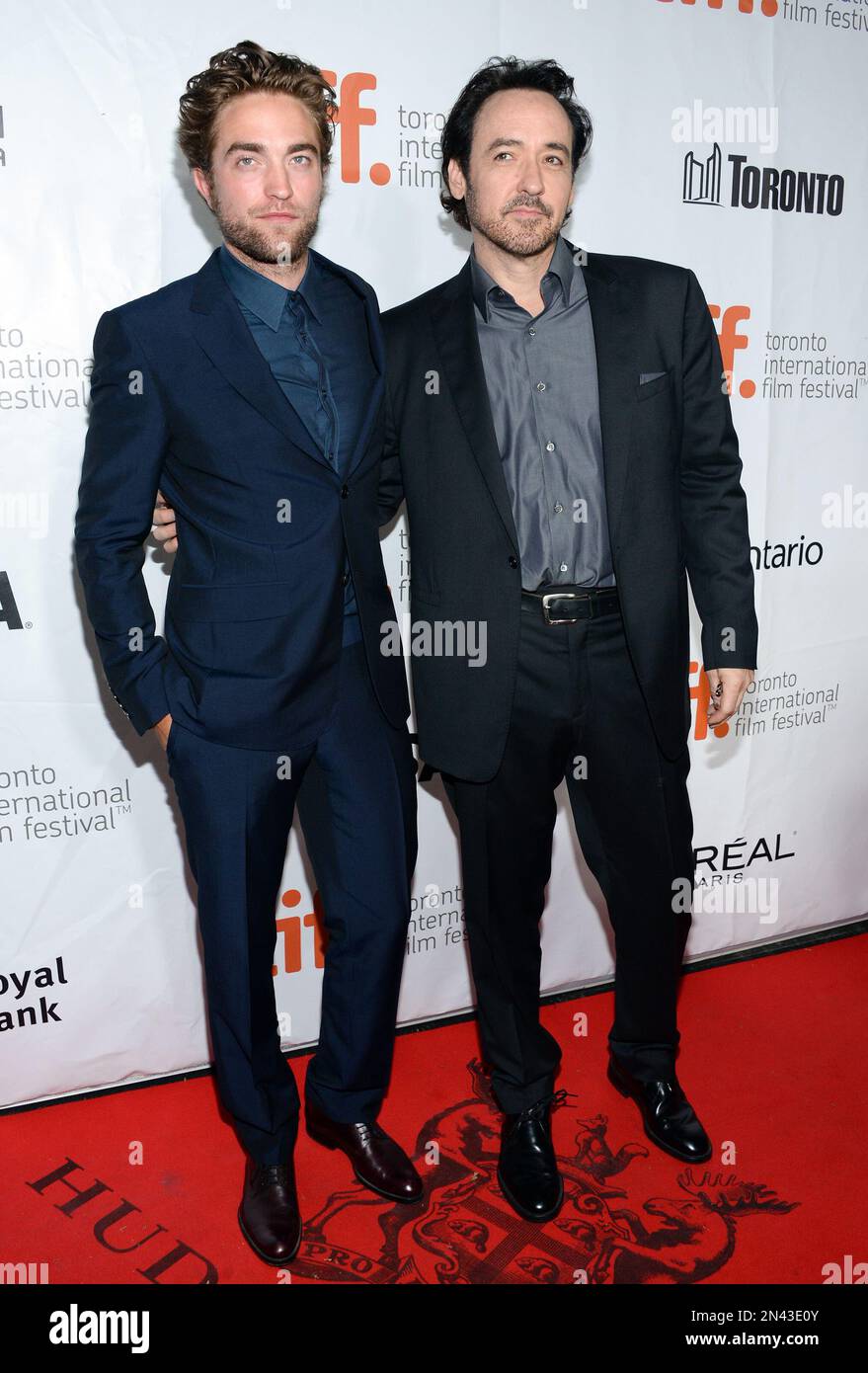 Actors Robert Pattinson, left, and John Cusack attend the "Maps to the ...