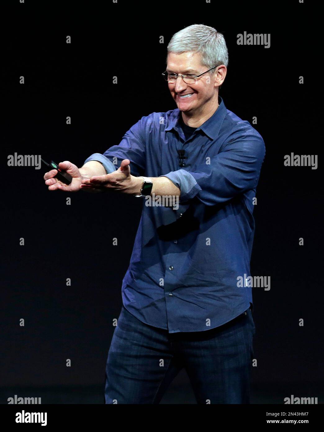 Apple CEO Tim Cook introduces the new Apple Watch, which he is wearing ...