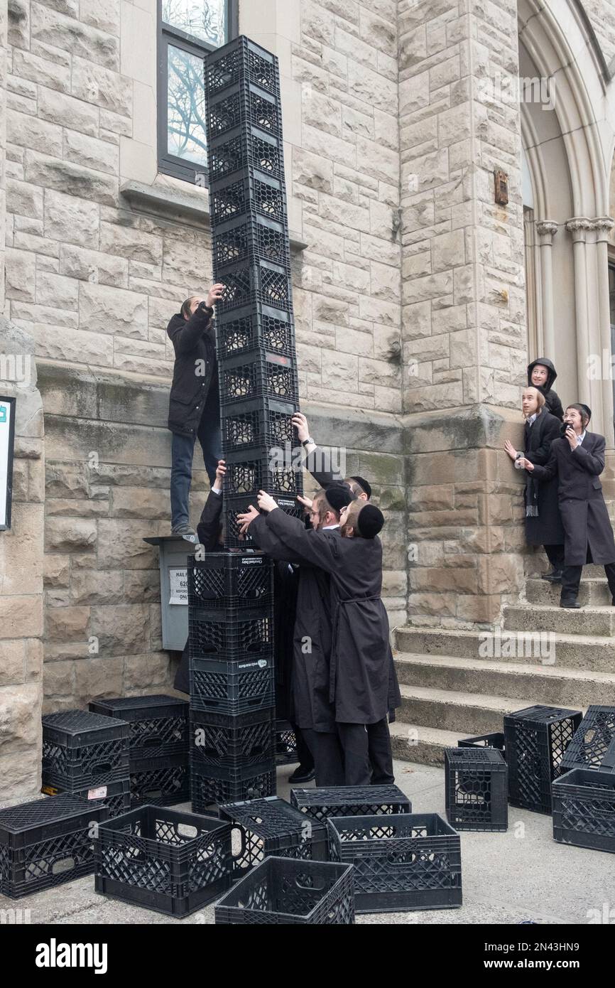 Ultra orthodox Jewish yeshiva students at an urban school build a tower ...