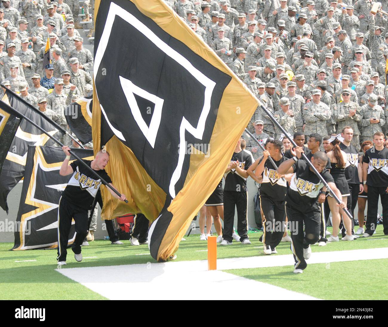 Army cheerleaders perform during the second half of an NCAA college ...