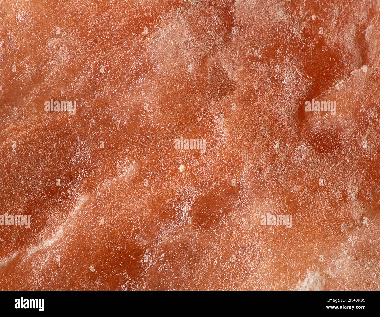 Bright surface texture of Himalayan salt block macro shot Stock Photo ...