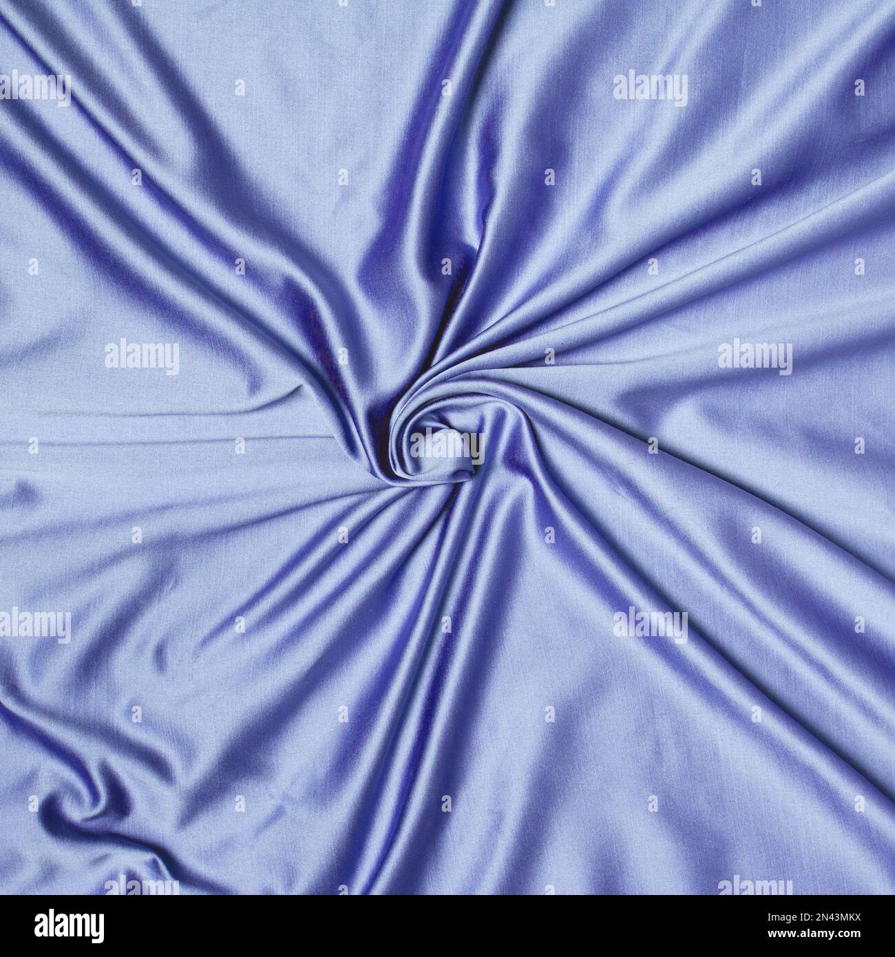 Abstract background, texture of crumpled silk twisted in a spiral ...