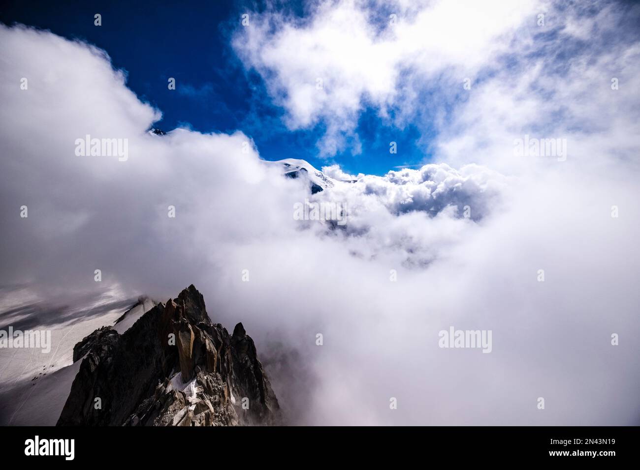 View from Aiguille du Midi of the summit of Mont Blanc, clouds moving in Stock Photo - Alamy