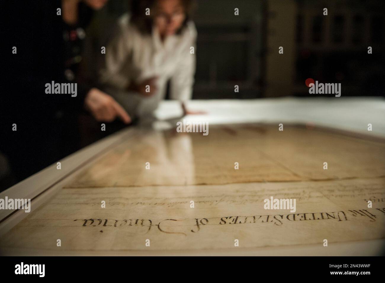 Terry Boone, Exhibits Conservator from the National Archives prepares ...