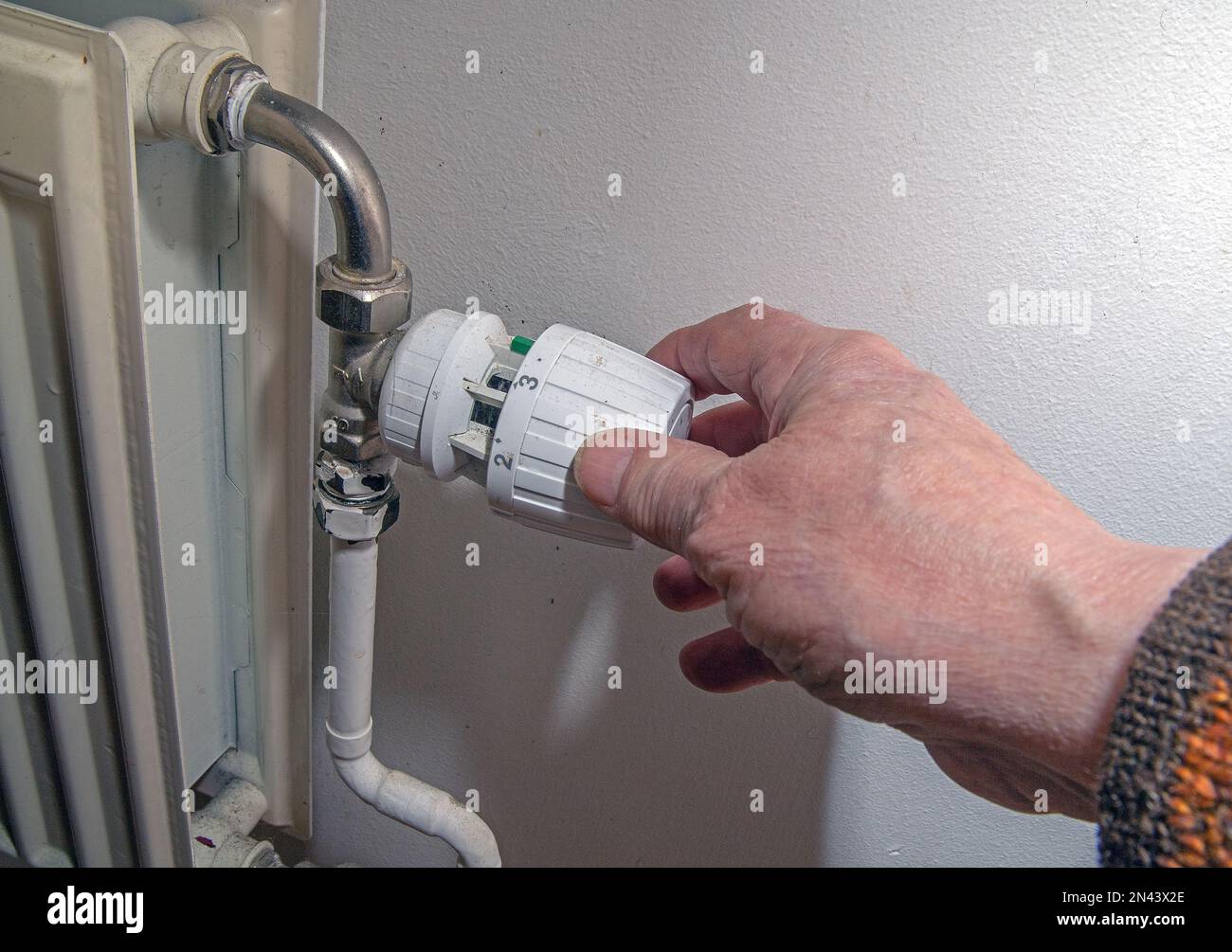 Persons hand using radiator thermostat hi-res stock photography and ...