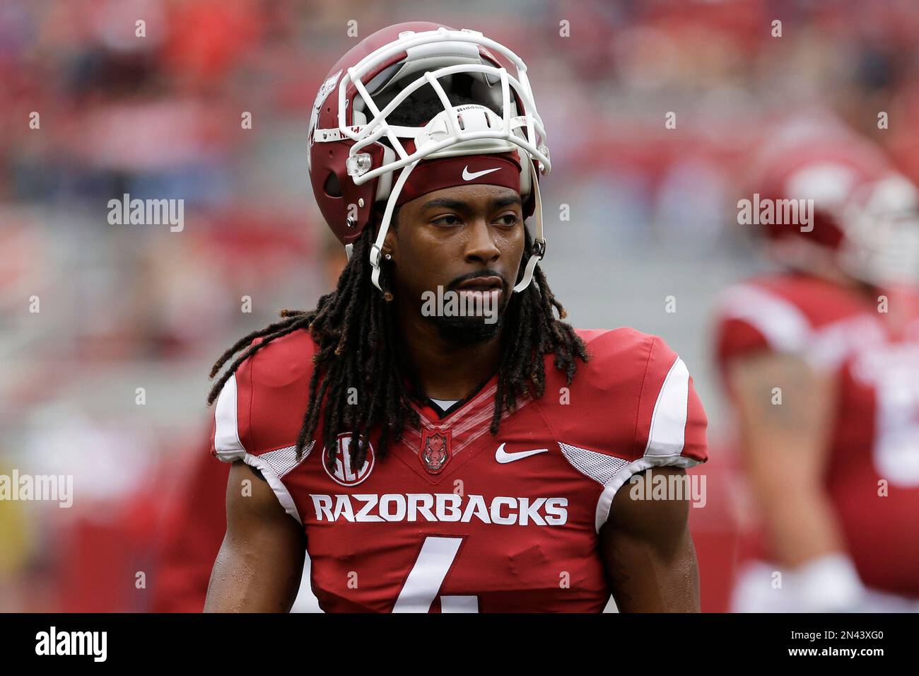 Arkansas wide receiver Keon Hatcher walks onto the before the first ...