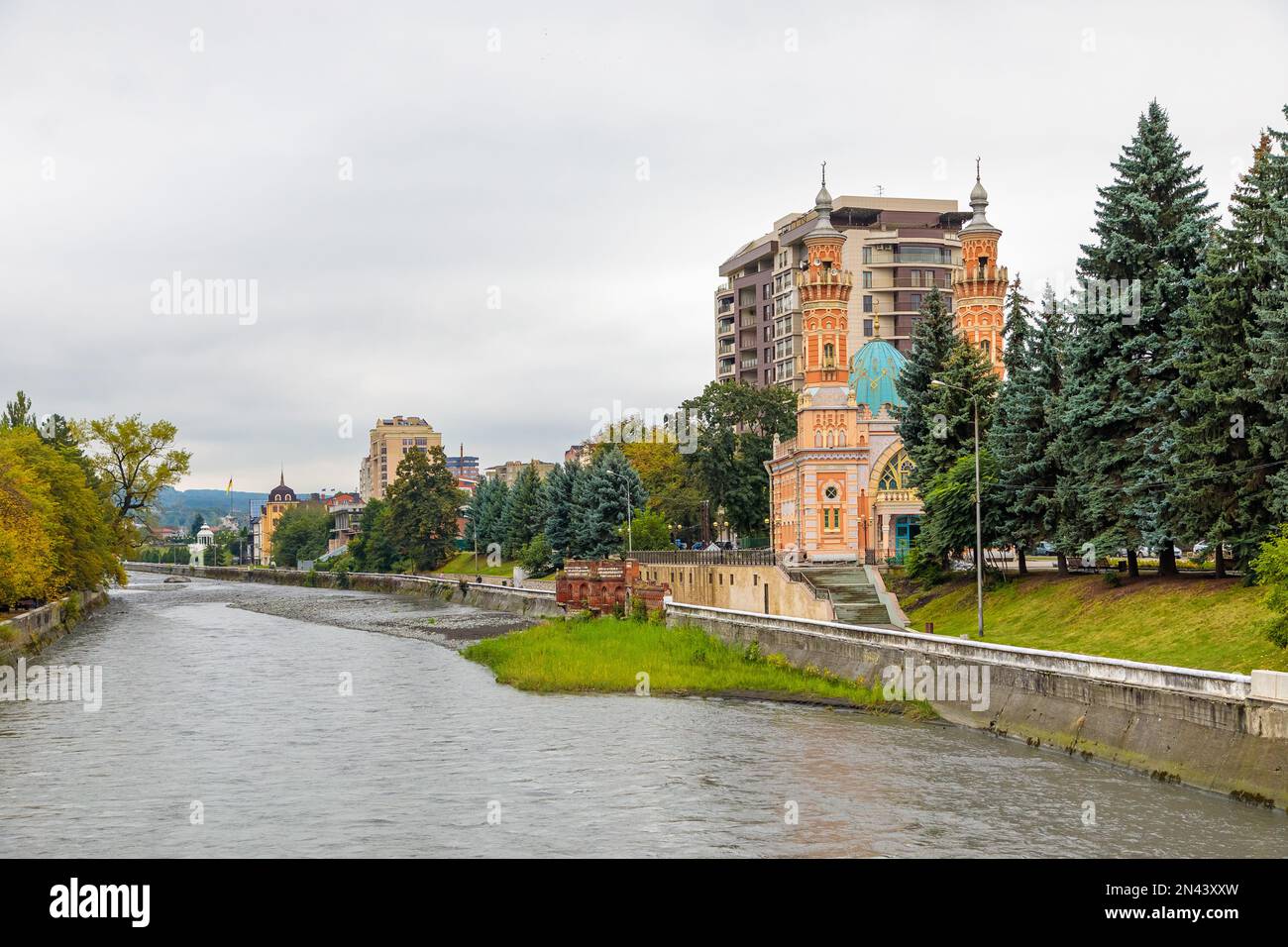 Terek river in Vladikavkaz. Urban landscape. Church and modern ...