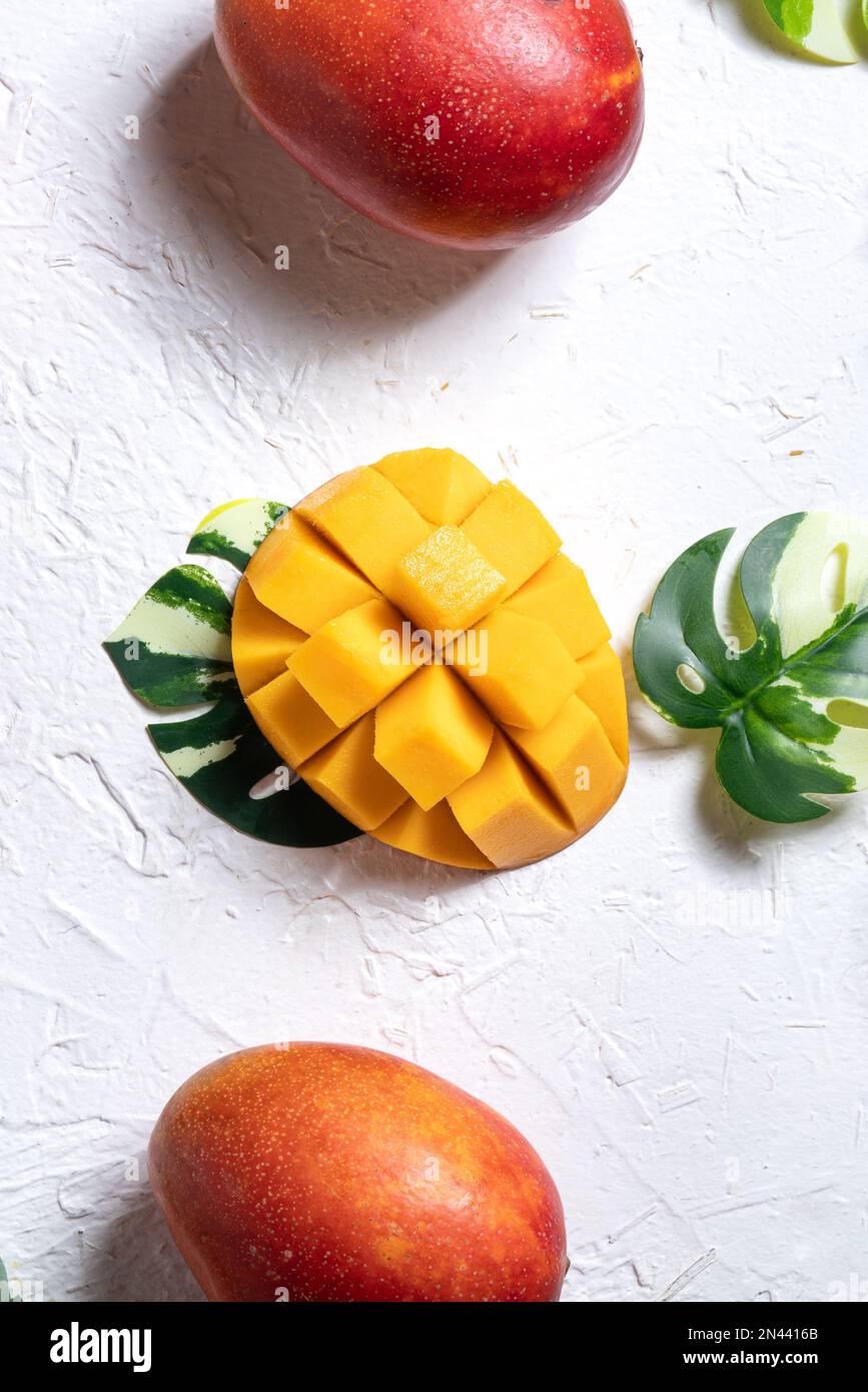 Mango background design concept. Top view of diced fresh mango fruit ...