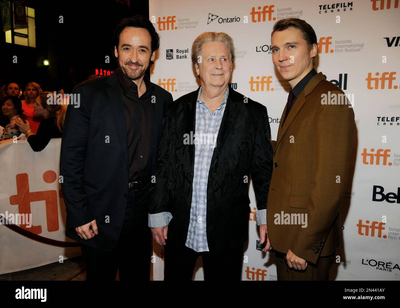 Singer-songwriter Brian Wilson of the Beach Boys, center, poses with ...