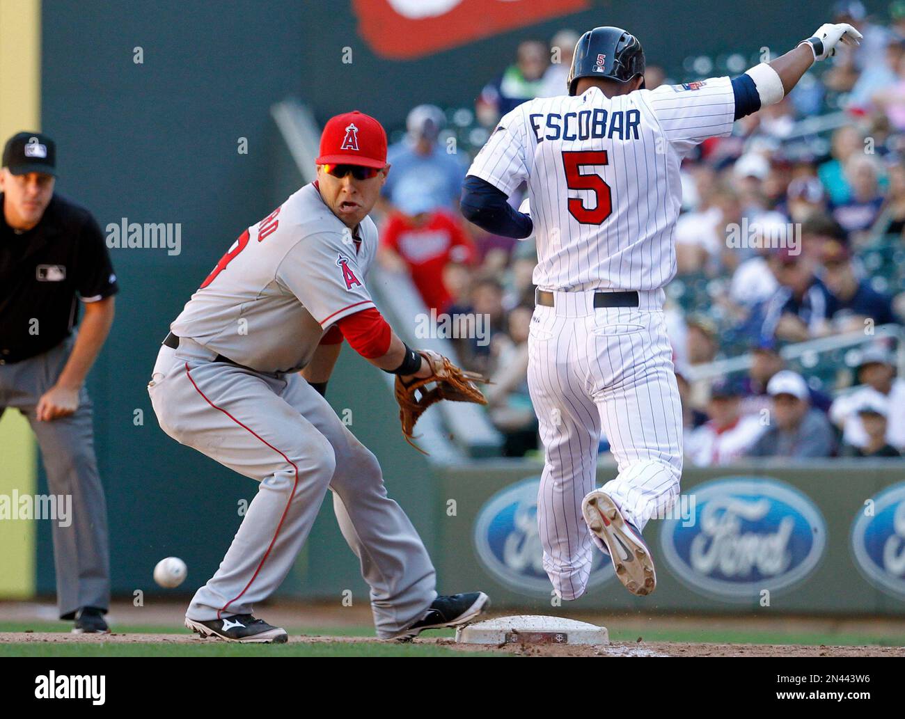 Minnesota Twins' Eduardo Escobar (5) is safe at first on an infield ...
