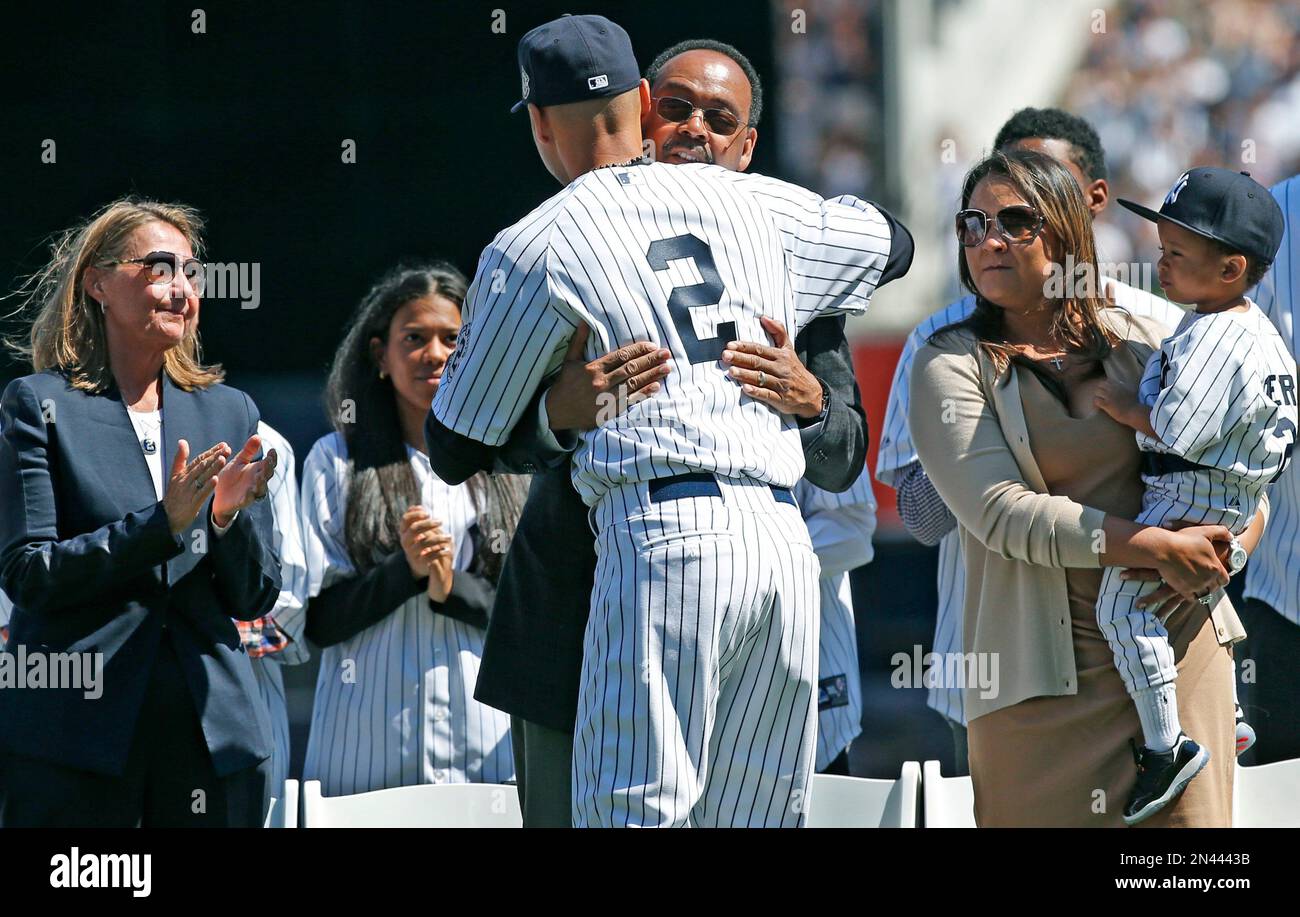 New York Yankees Derek Jeter (2) embraces his father Dr. Charles Jeter ...