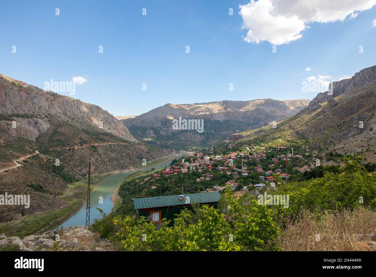 Valley view of Kemaliye town. View of the old Kemaliye houses and the ...