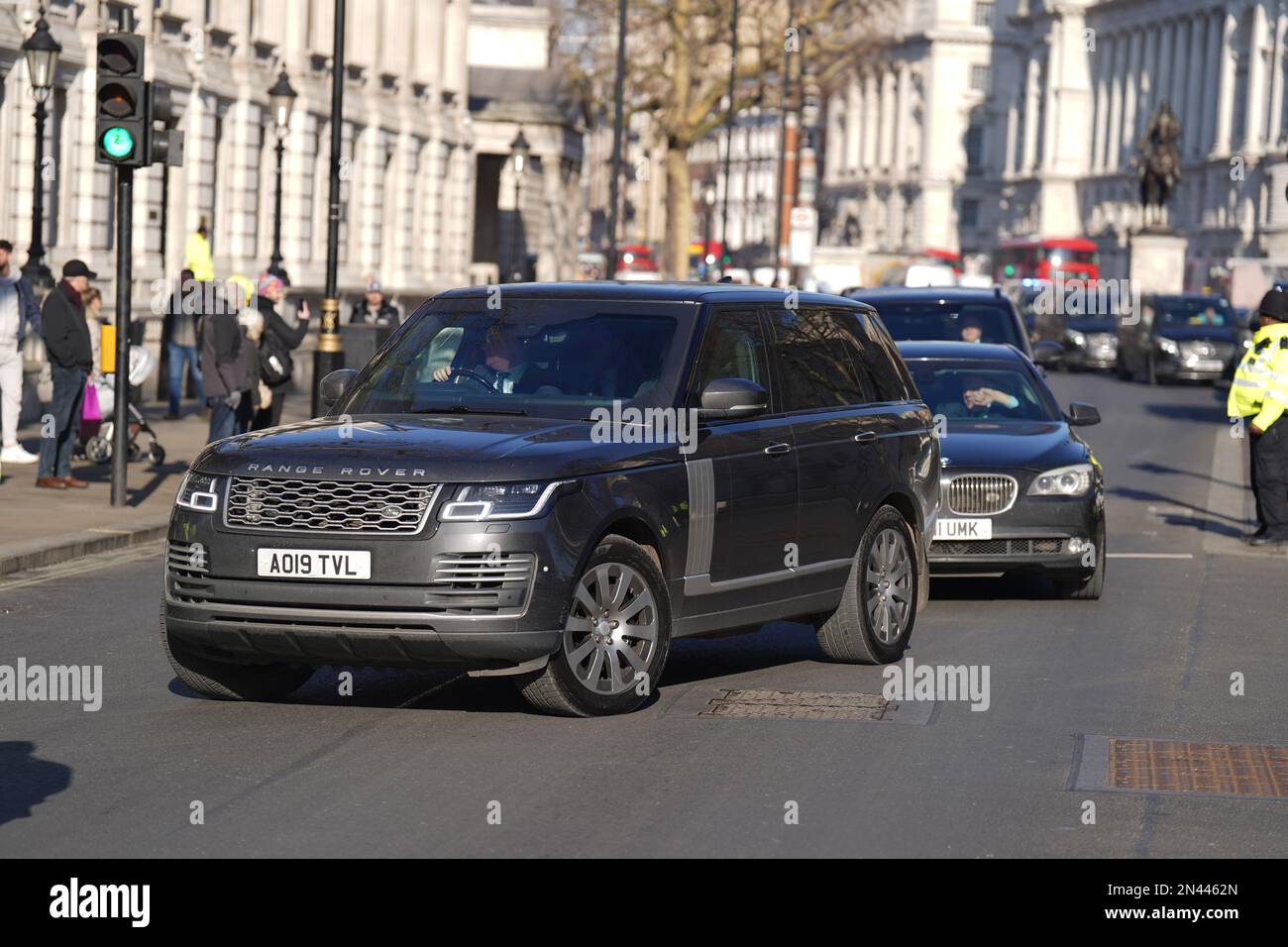 A convoy of cars carrying Ukrainian President Volodymyr Zelensky drives ...