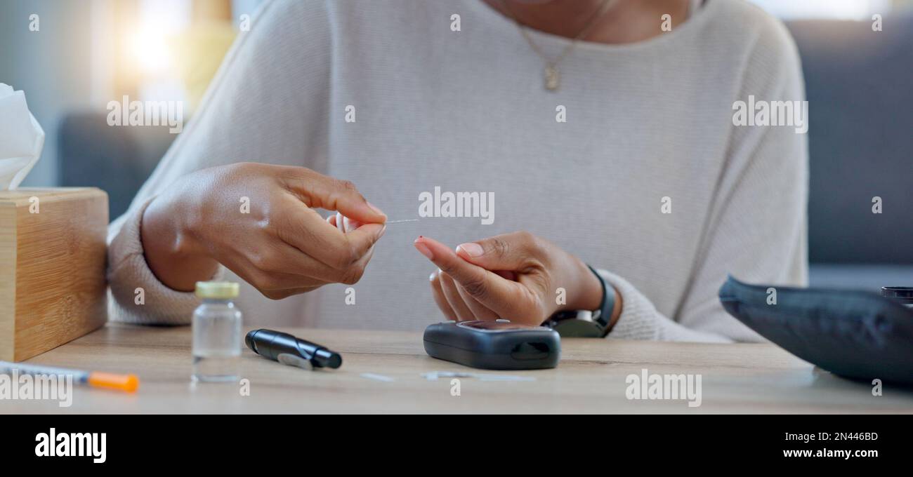 Woman with syringe preparing an insulin injection at home with an ...