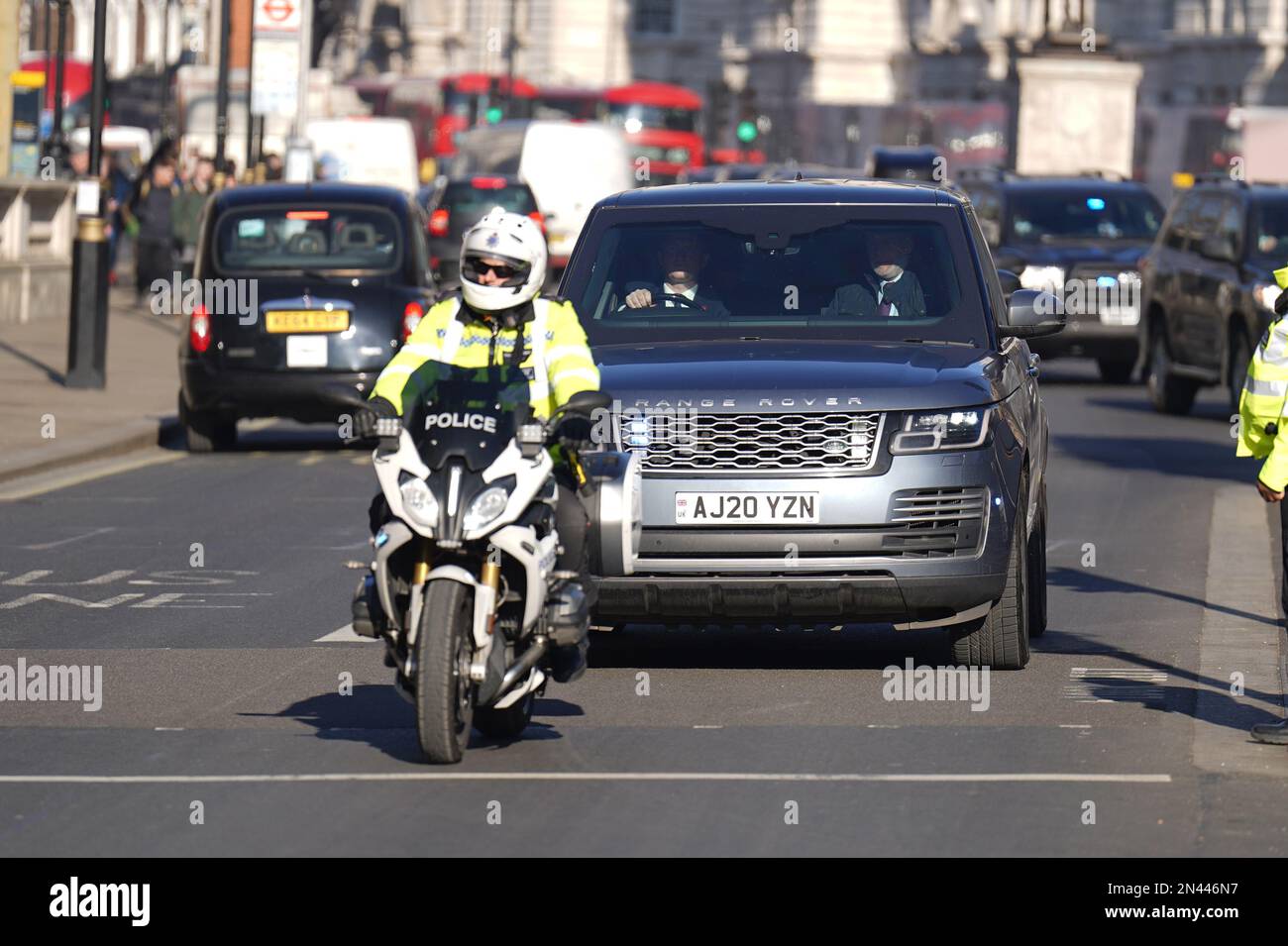 A convoy of cars carrying Ukrainian President Volodymyr Zelensky drives ...