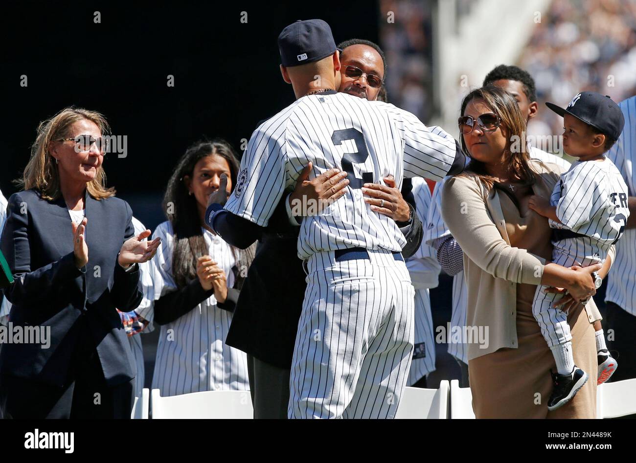 New York Yankees' Derek Jeter (2) embraces his father, Dr. Charles ...