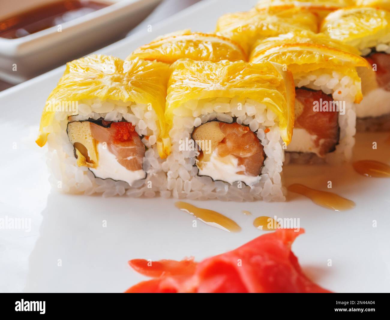 Rolls with rice, seaweed nori, salmon, cream cheese, chicken egg ...