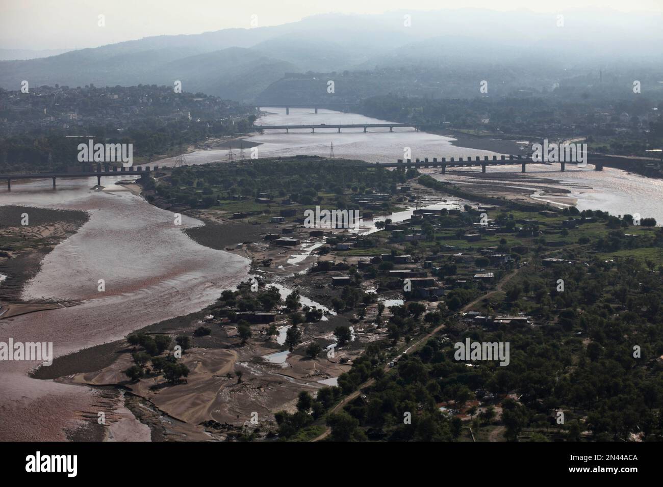 An aerial view of the banks of the Tawi River that was damaged in the ...