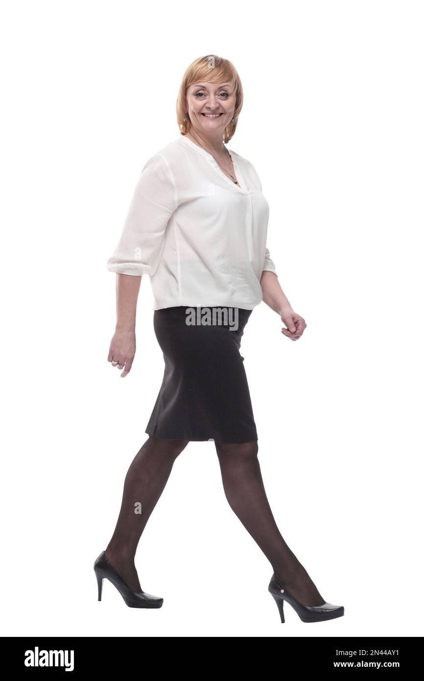 in full growth. smiling business woman striding forward Stock Photo - Alamy