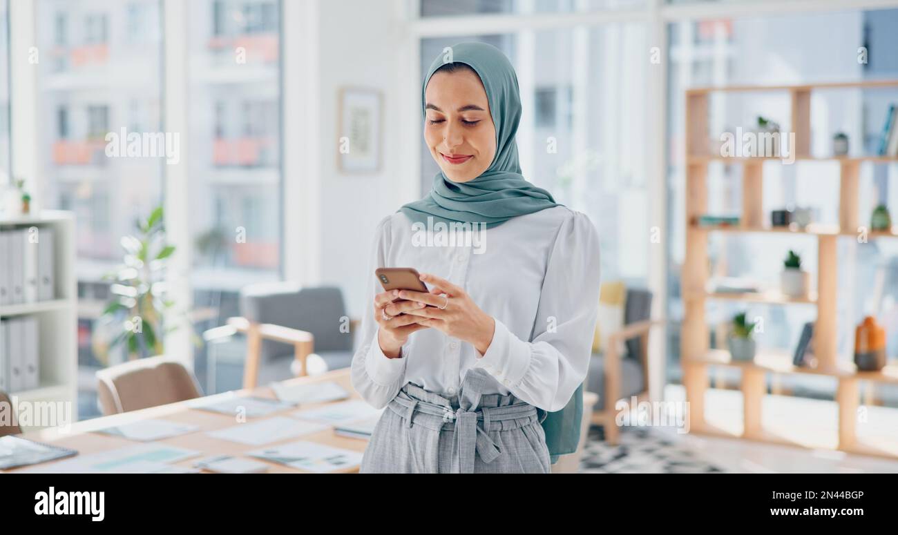 Phone, thinking and feedback with a business muslim woman typing a text ...