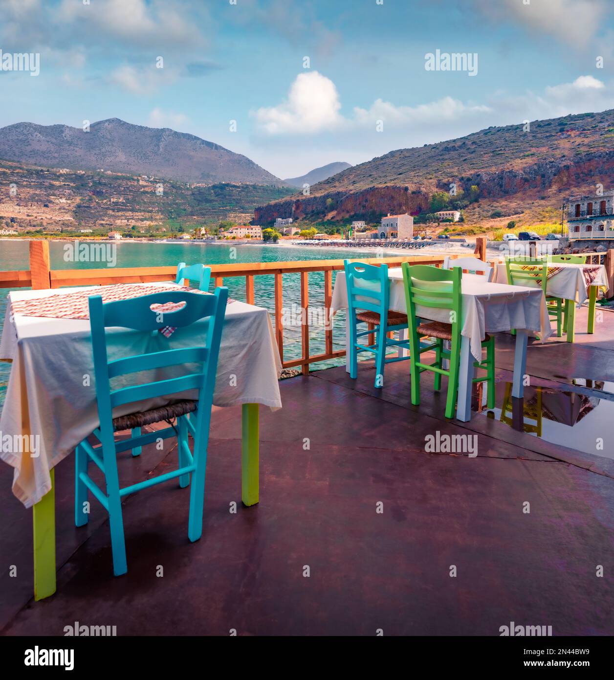 Spectacular summer cityscape of Neo Itilo village. Hospitable cafe on ...