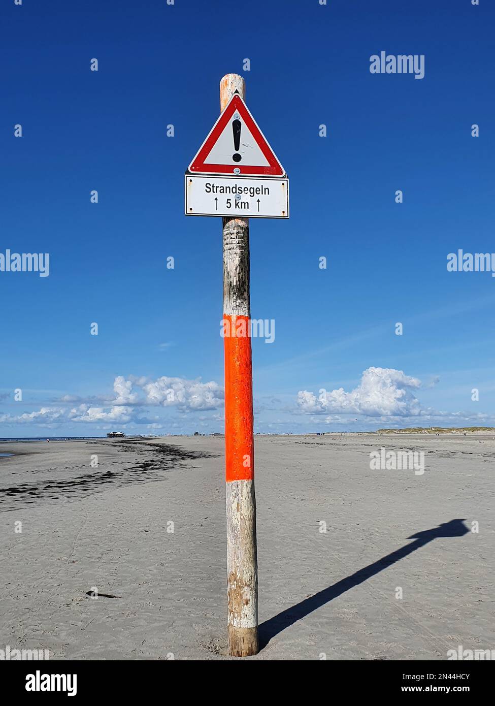 A closeup of a warning sign with "stand sailing" writing on, sunny ...