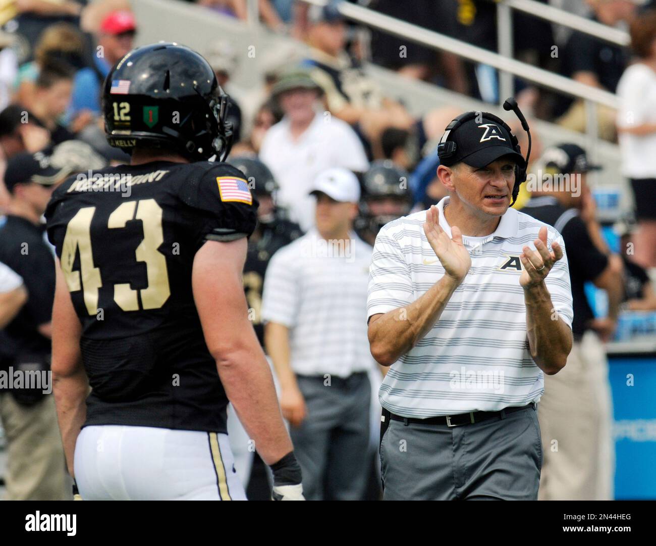 Army head coach Jeff Monken instructs his players during the first half ...