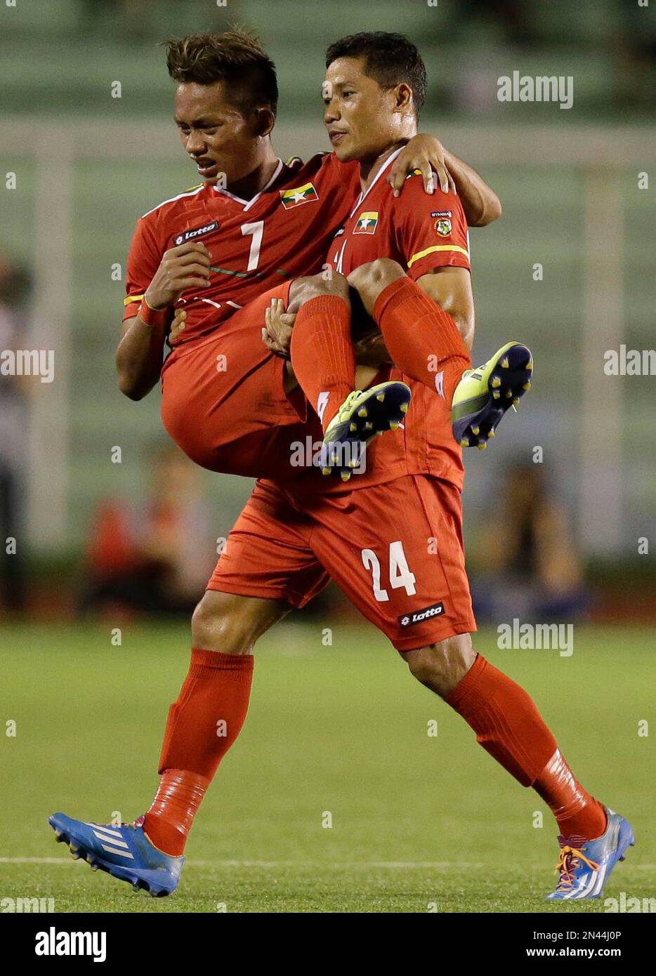 Myanmar's Win Min Htut (24) carries his teammate Kyaw Zayar Win after the latter was injured in ...